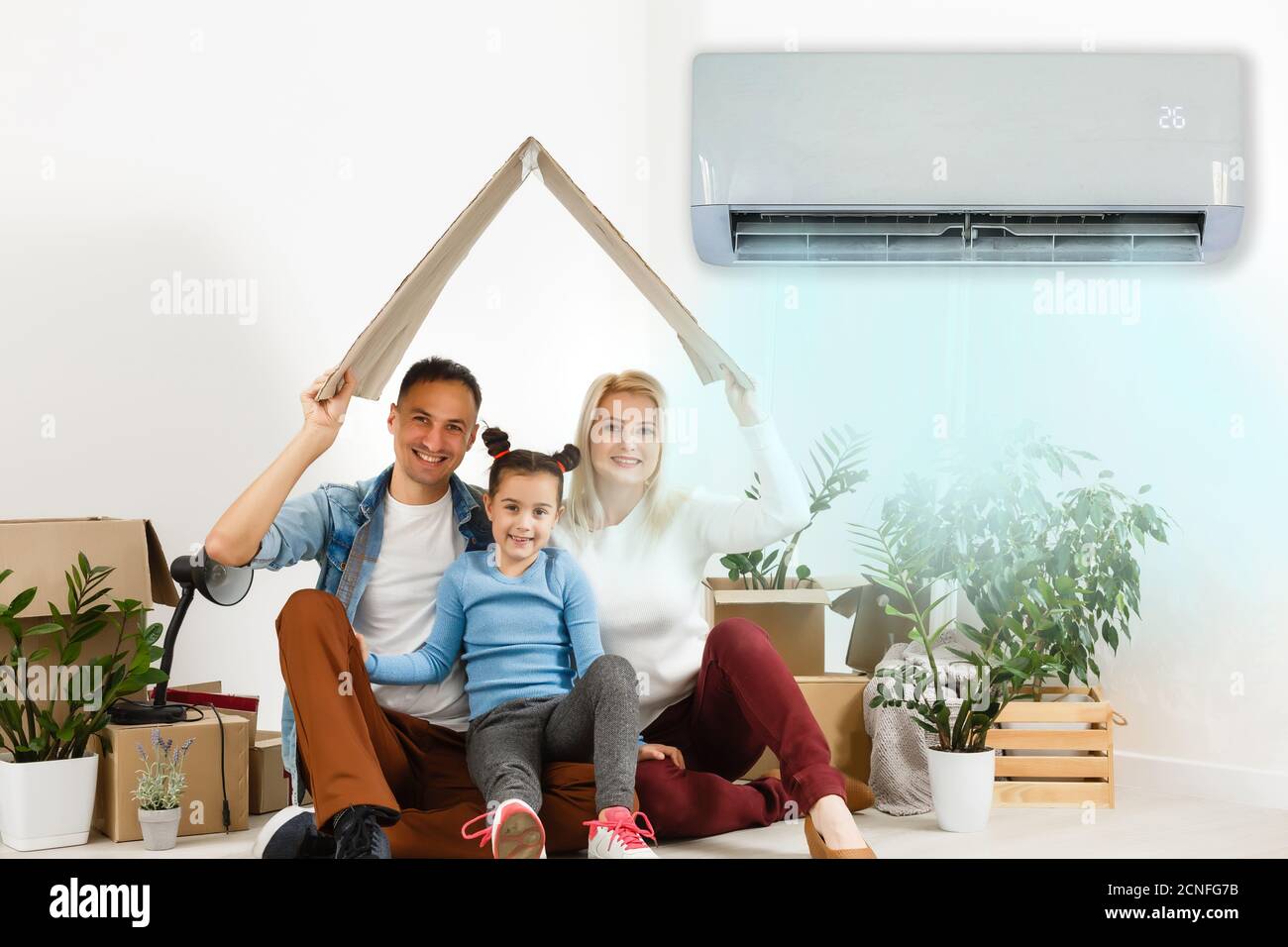 Happy Family Under Air Conditioning At Home Stock Photo - Alamy