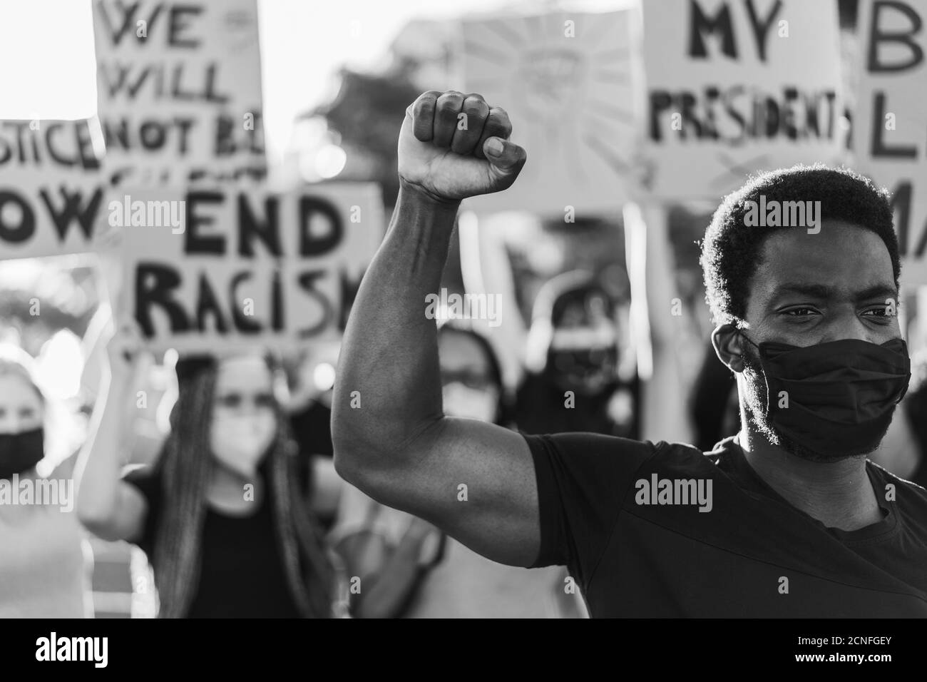 Multiracial people wearing face mask during equal rights protest ...