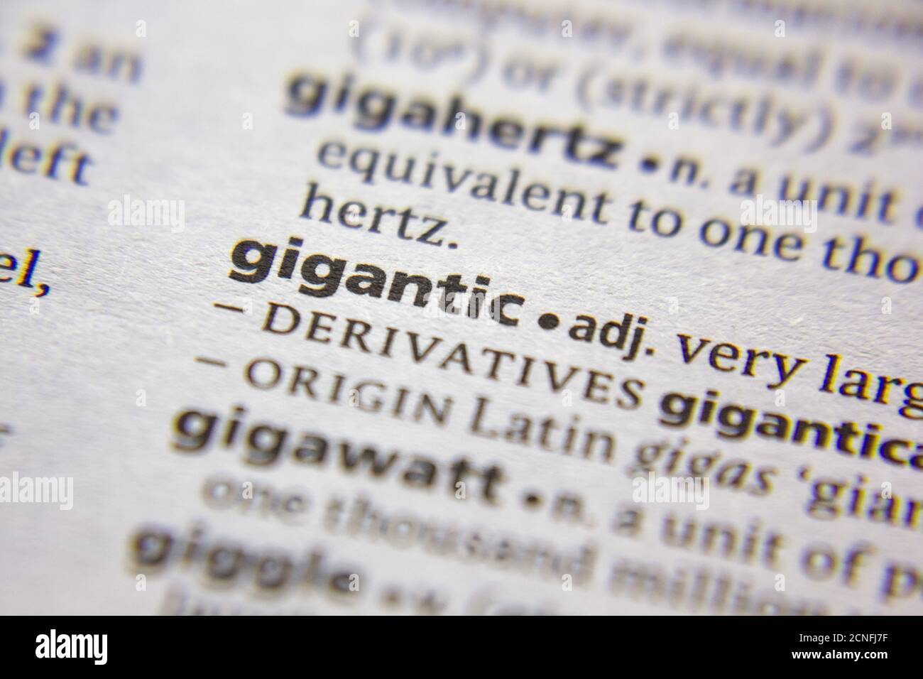 Word or phrase Gigantic in a dictionary Stock Photo - Alamy