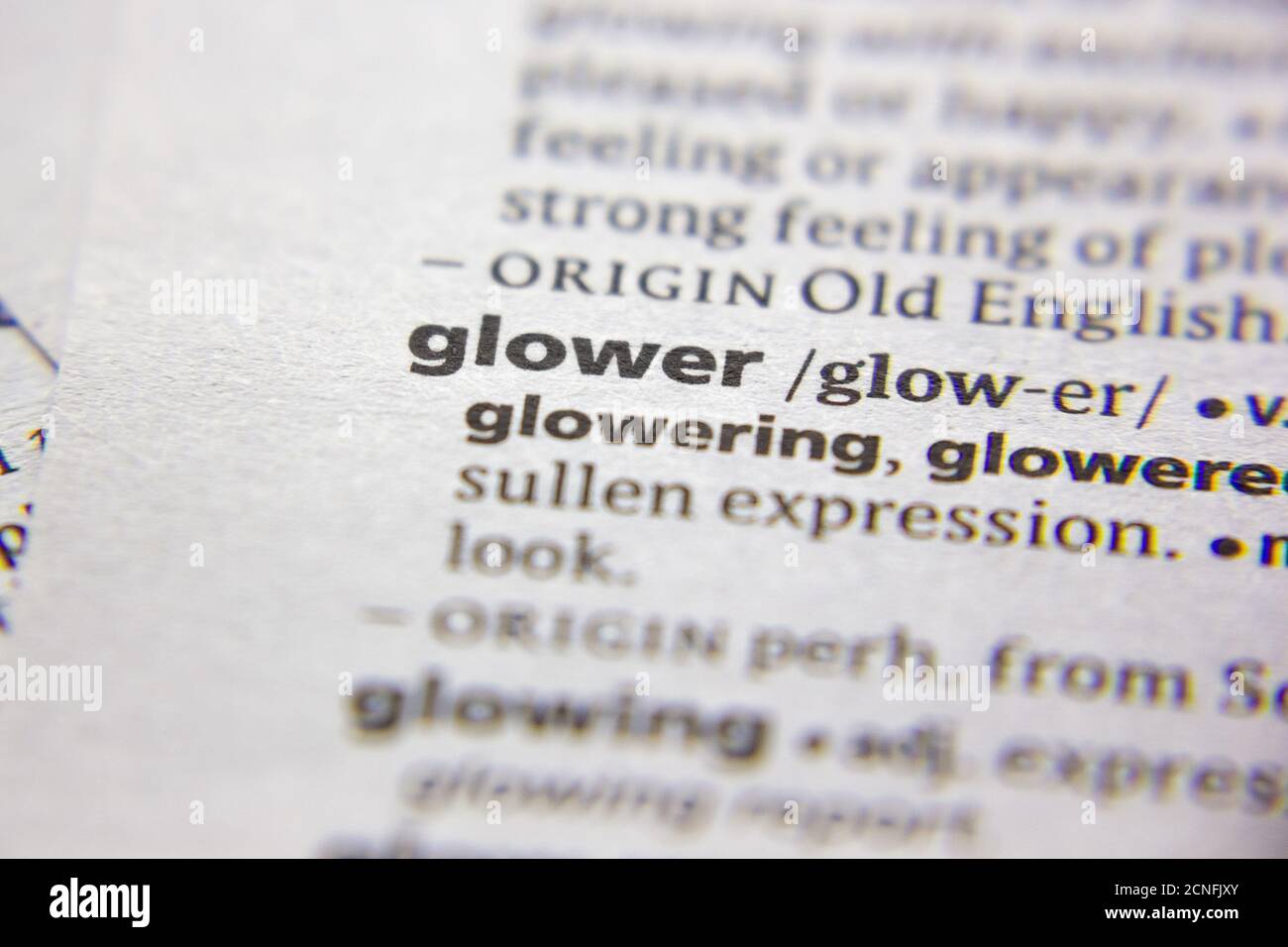 Word or phrase Glower in a dictionary Stock Photo - Alamy