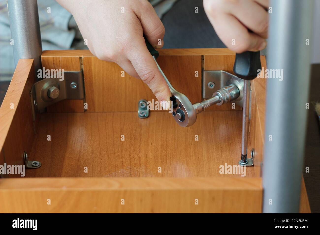 Hands screwing screw socket hi-res stock photography and images - Alamy