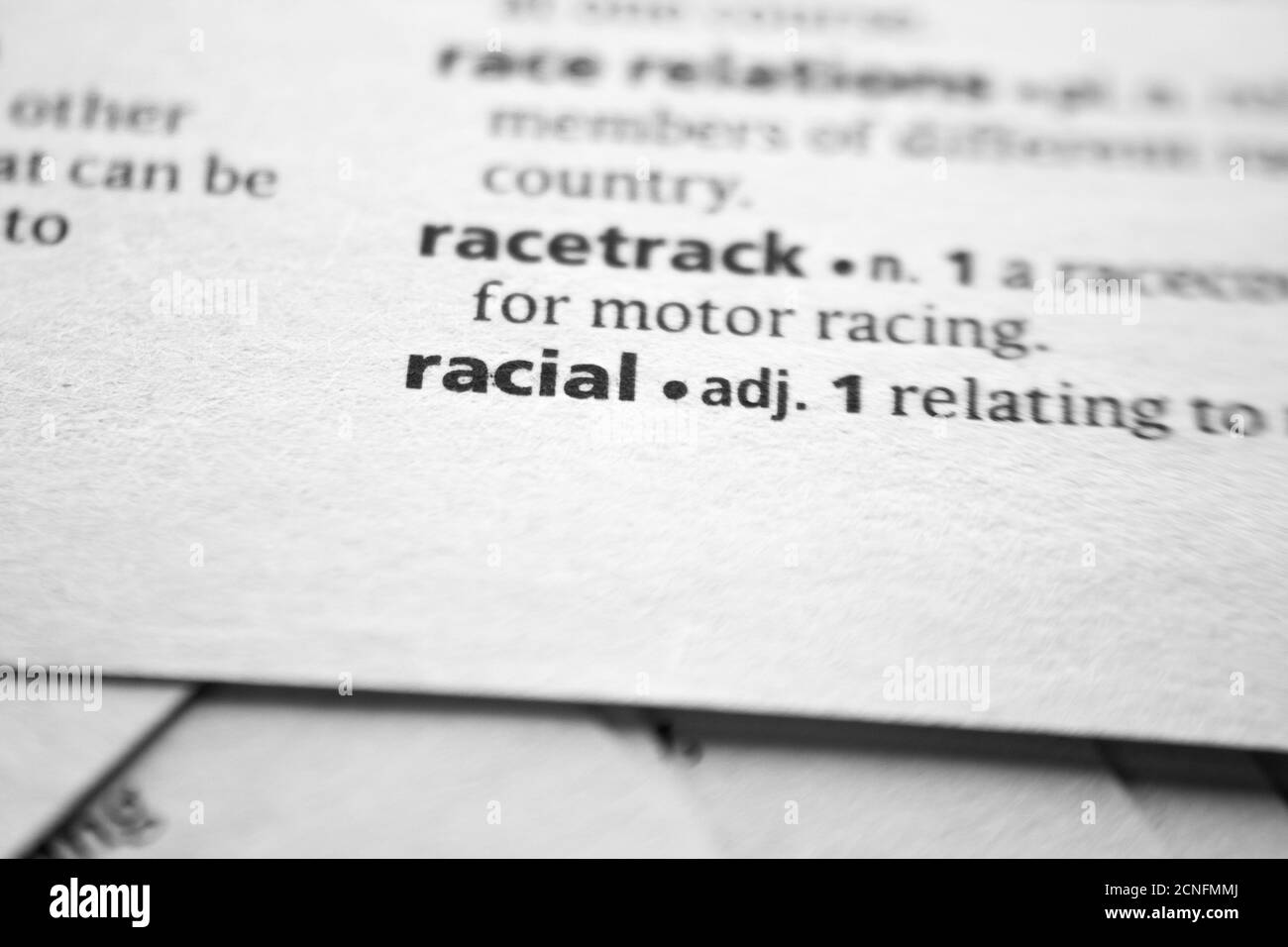 Word or phrase Racial in a dictionary Stock Photo - Alamy