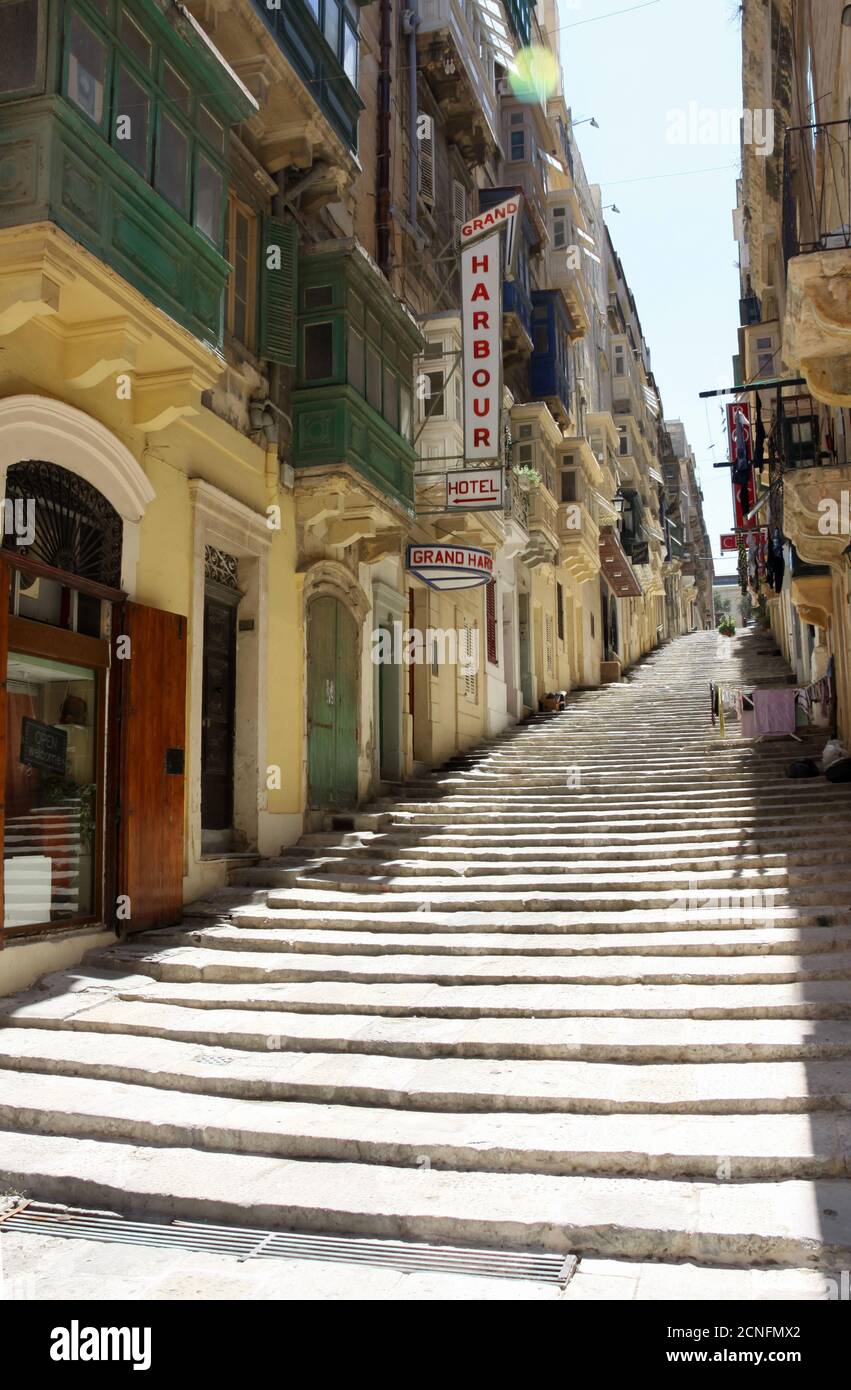 A long set of old stone steps in the sunshine in Valletta, Malta Stock ...