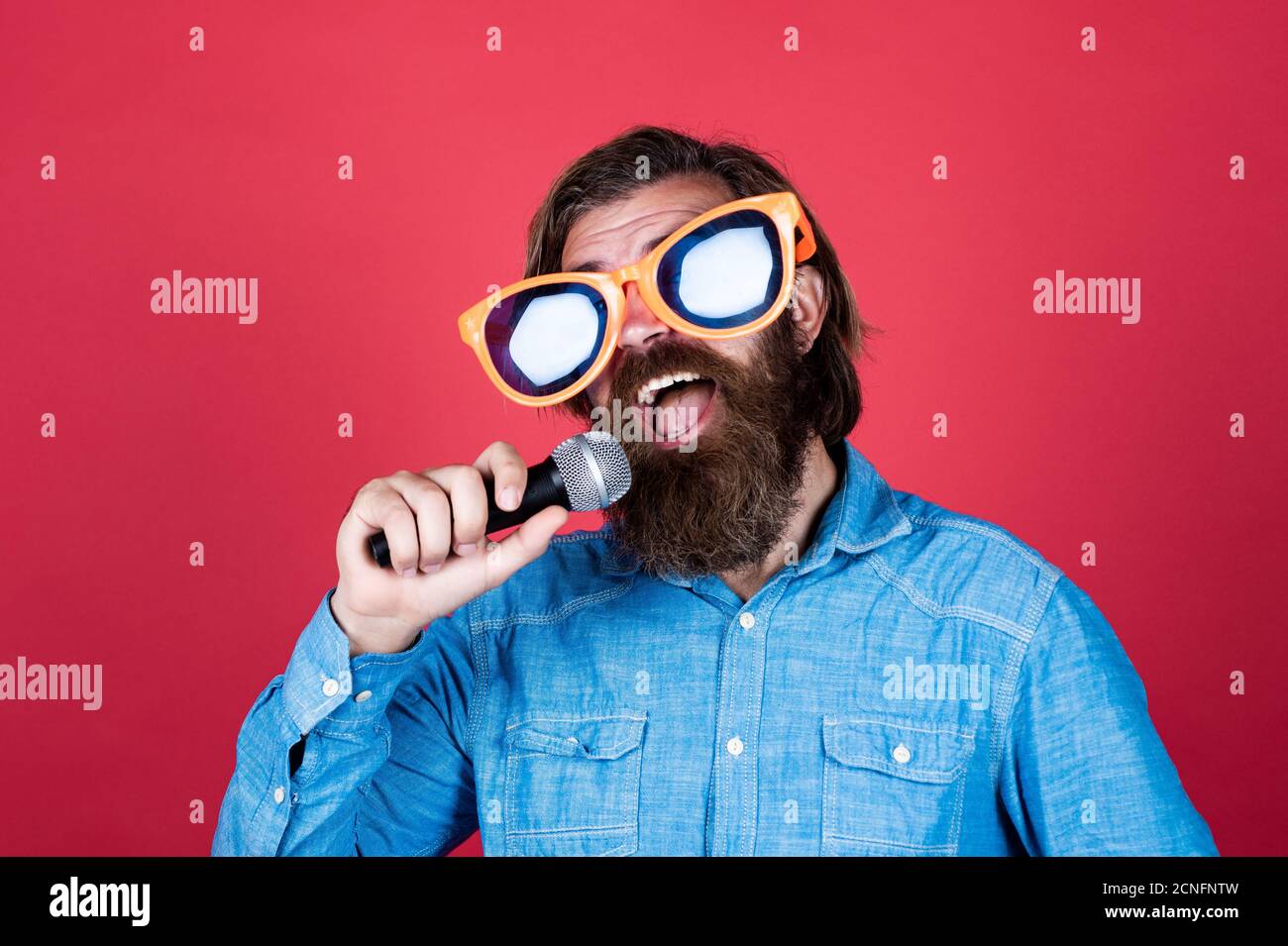 Bring music to life. performer having fun. mature bearded man in funny ...