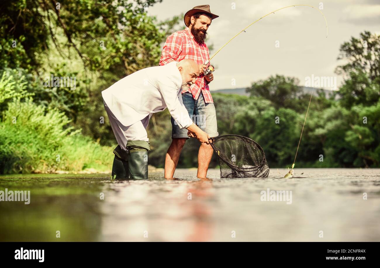 Happy family concept. Catching and fishing concept. Two male friends ...