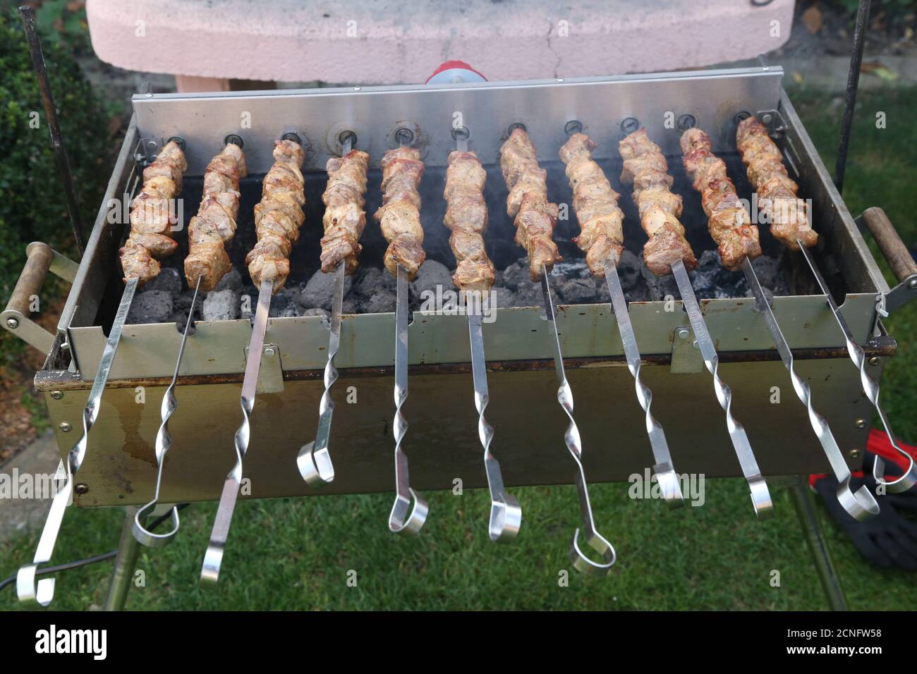 Roasted meat cooked at barbecue with smoke Stock Photo - Alamy