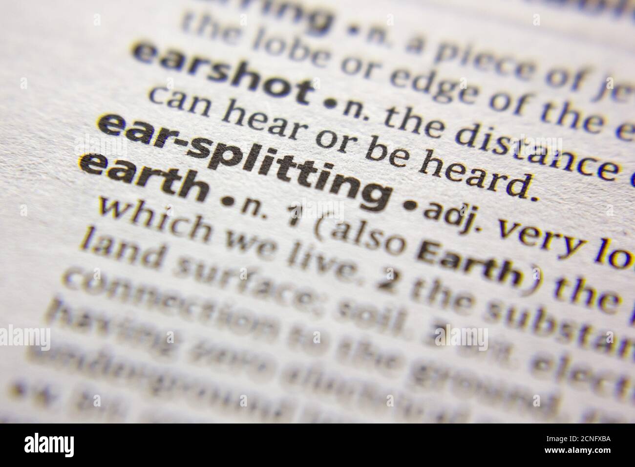 Word or phrase Ear-splitting in a dictionary Stock Photo - Alamy