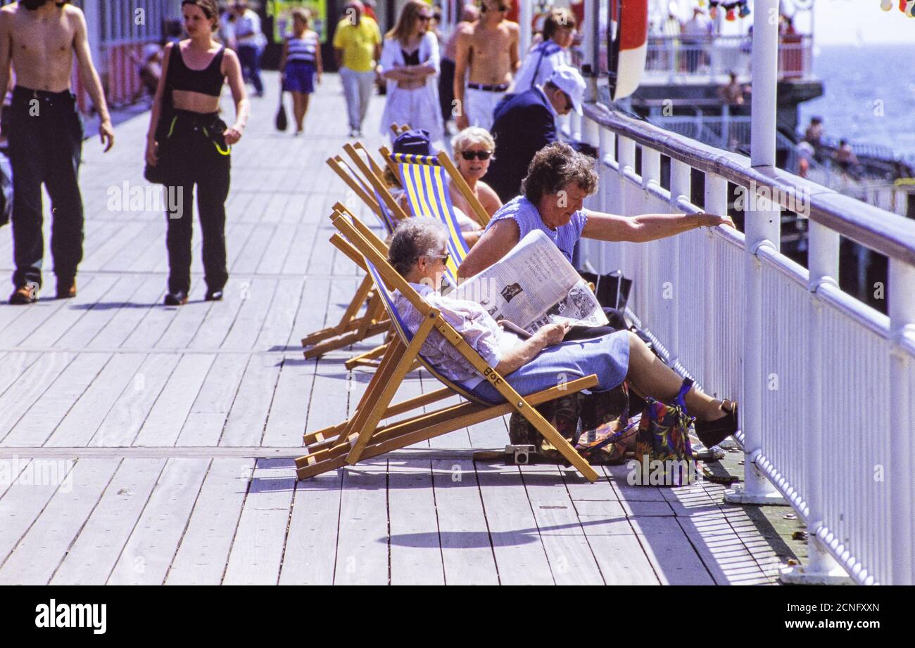 Holidaymakers enjoy the sun, sea and sand on Bournemouth Beach on the ... Holidaymakers enjoy the sun, sea and sand on Bournemouth Beach on the ...