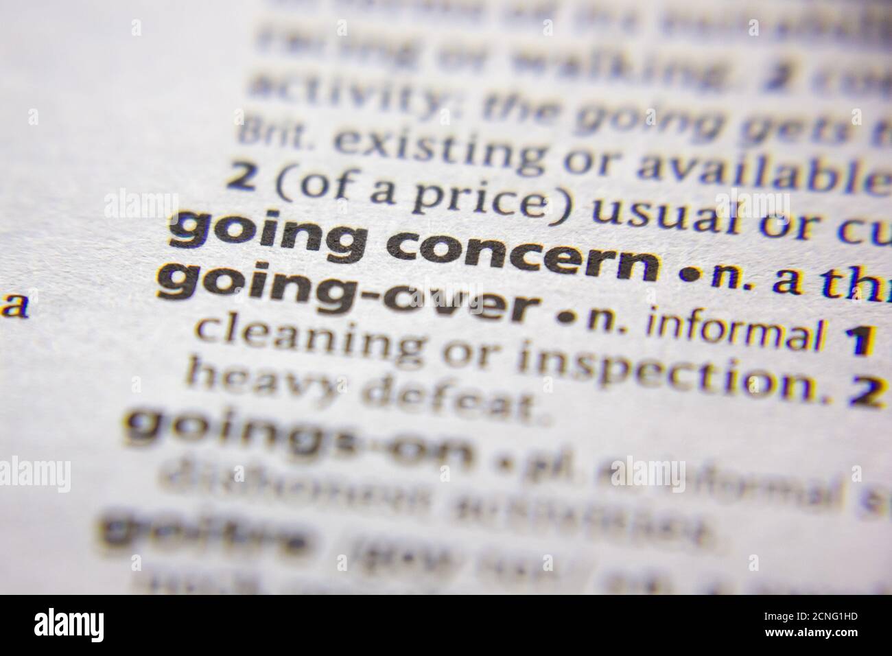 Word or phrase Going concern in a dictionary Stock Photo - Alamy