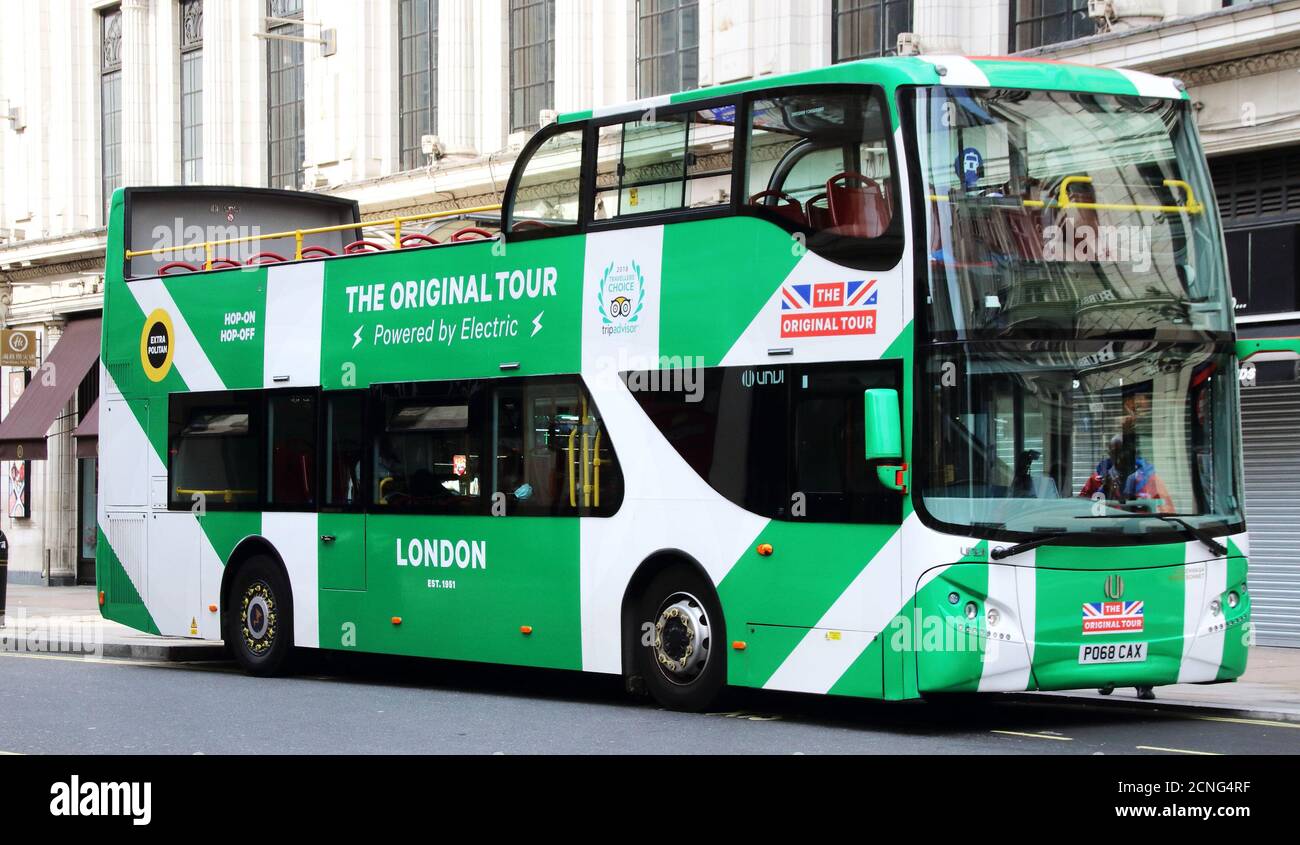 Green all electric London Tour Bus parked waiting for tourists Stock ...