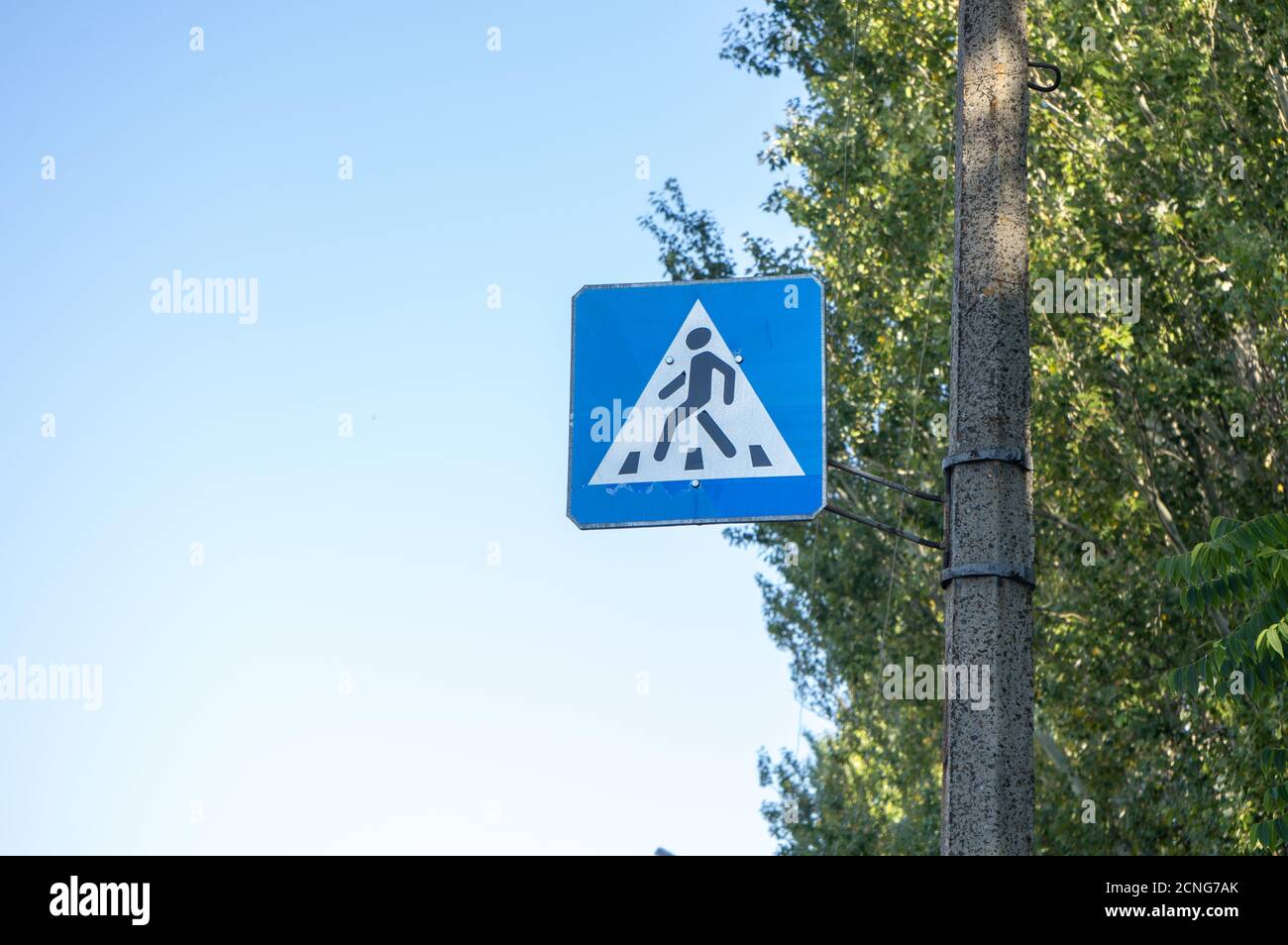 blue crosswalk road sign in a city Stock Photo - Alamy