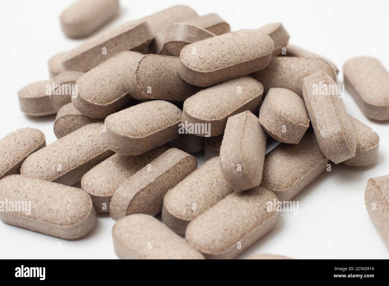 Stll life against a white background of some 600mg Siberian Ginseng ...