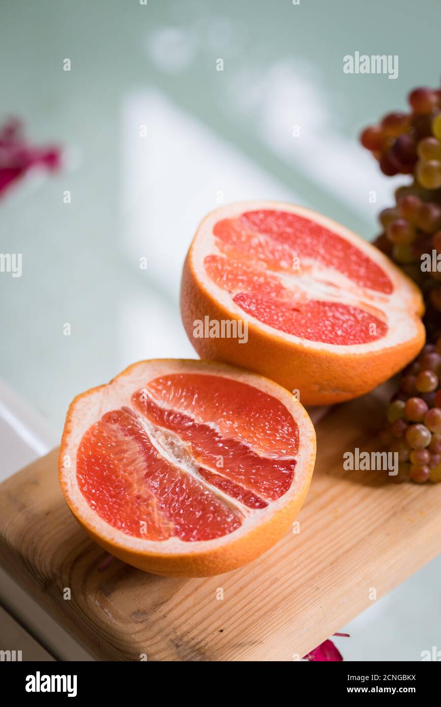 Healthy Organic Red Ruby Grapefruit on wooden background, toned Stock ...