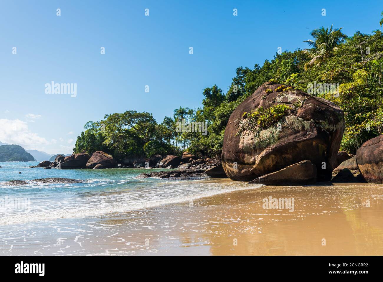 Rocks and hill next to desert beach in Brazil Stock Photo - Alamy