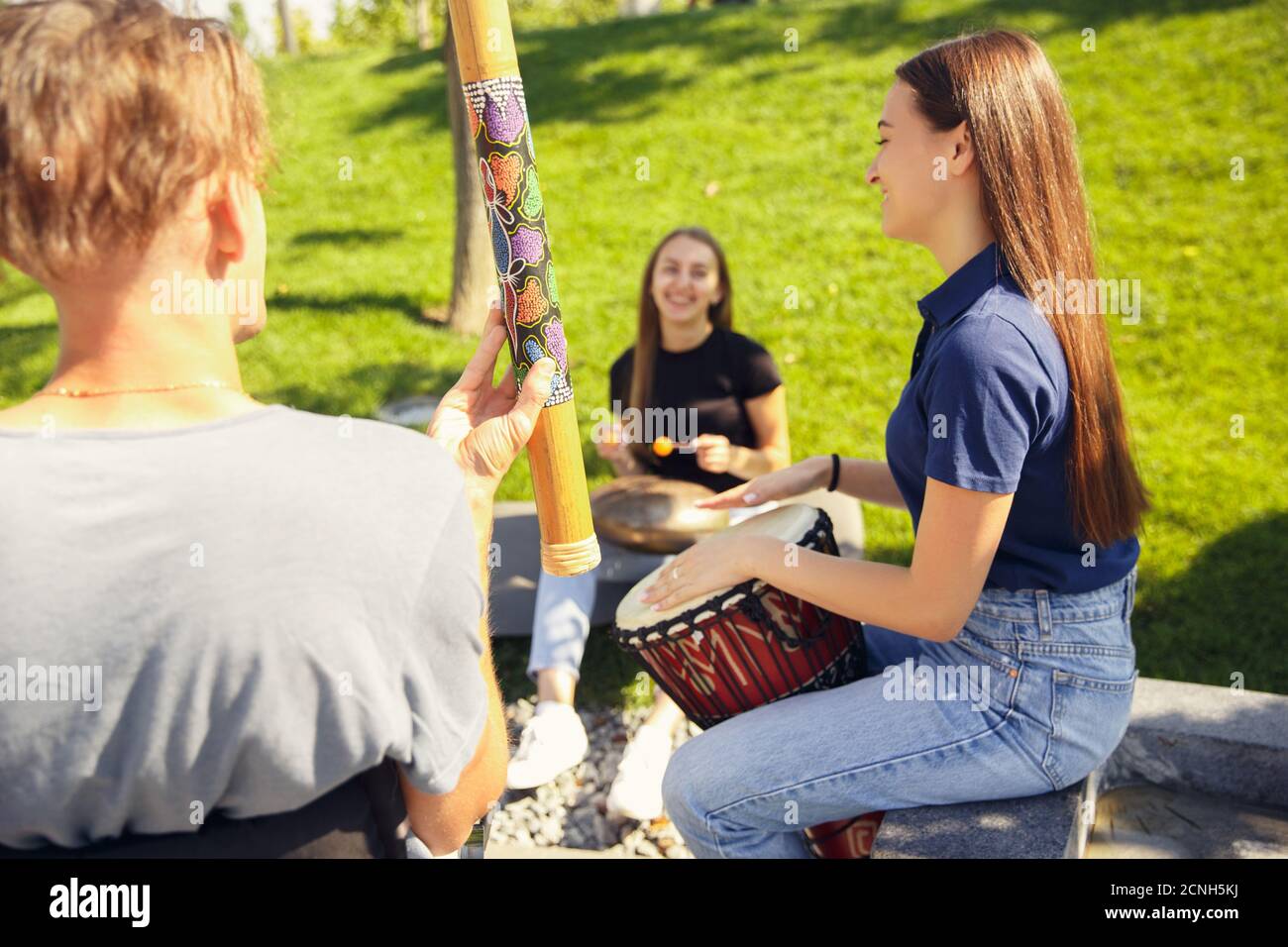 Full life. Happy handicapped man on a wheelchair spending time with ...
