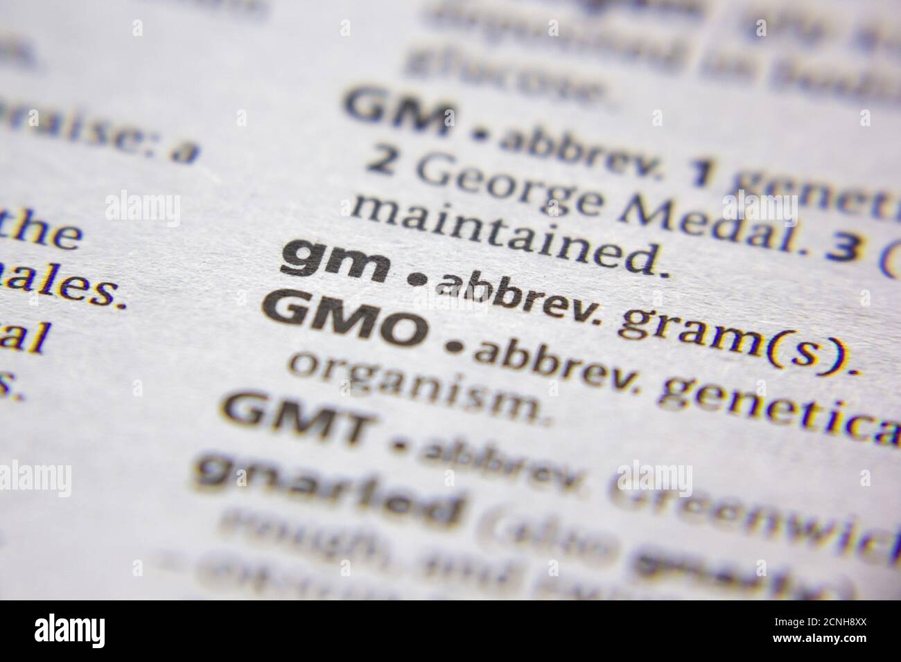 Word or phrase gm abbreviation of grams in a dictionary Stock Photo - Alamy