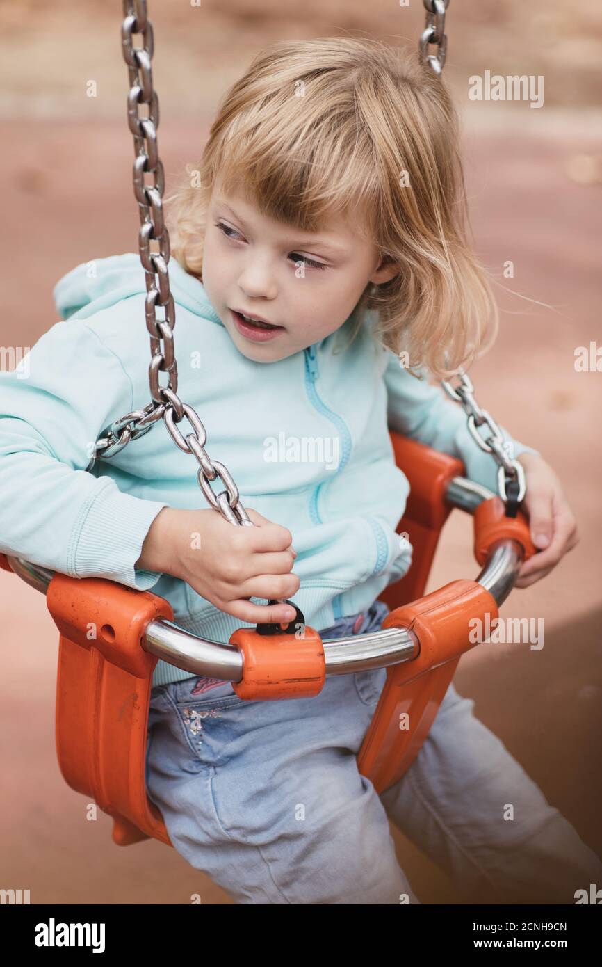 Little disabled girl plays on the playground Stock Photo - Alamy
