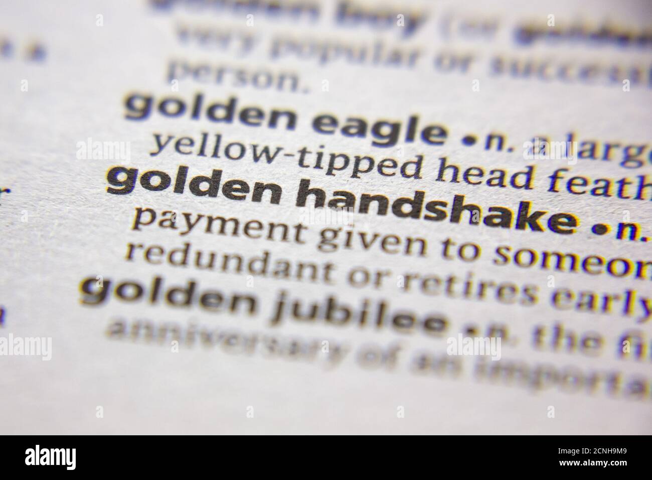 Word or phrase Golden handshake in a dictionary Stock Photo - Alamy