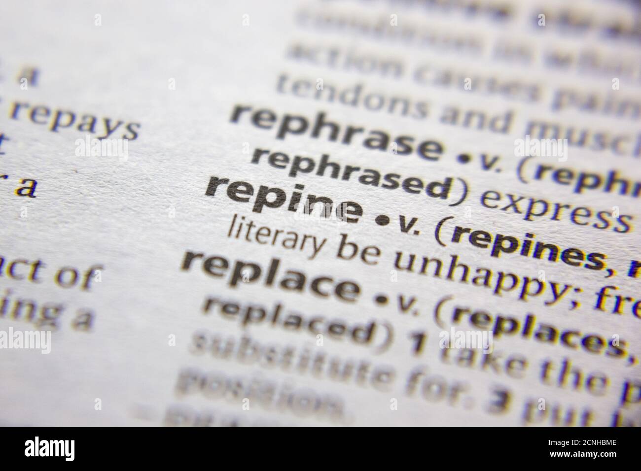 Word or phrase Repine in a dictionary Stock Photo - Alamy