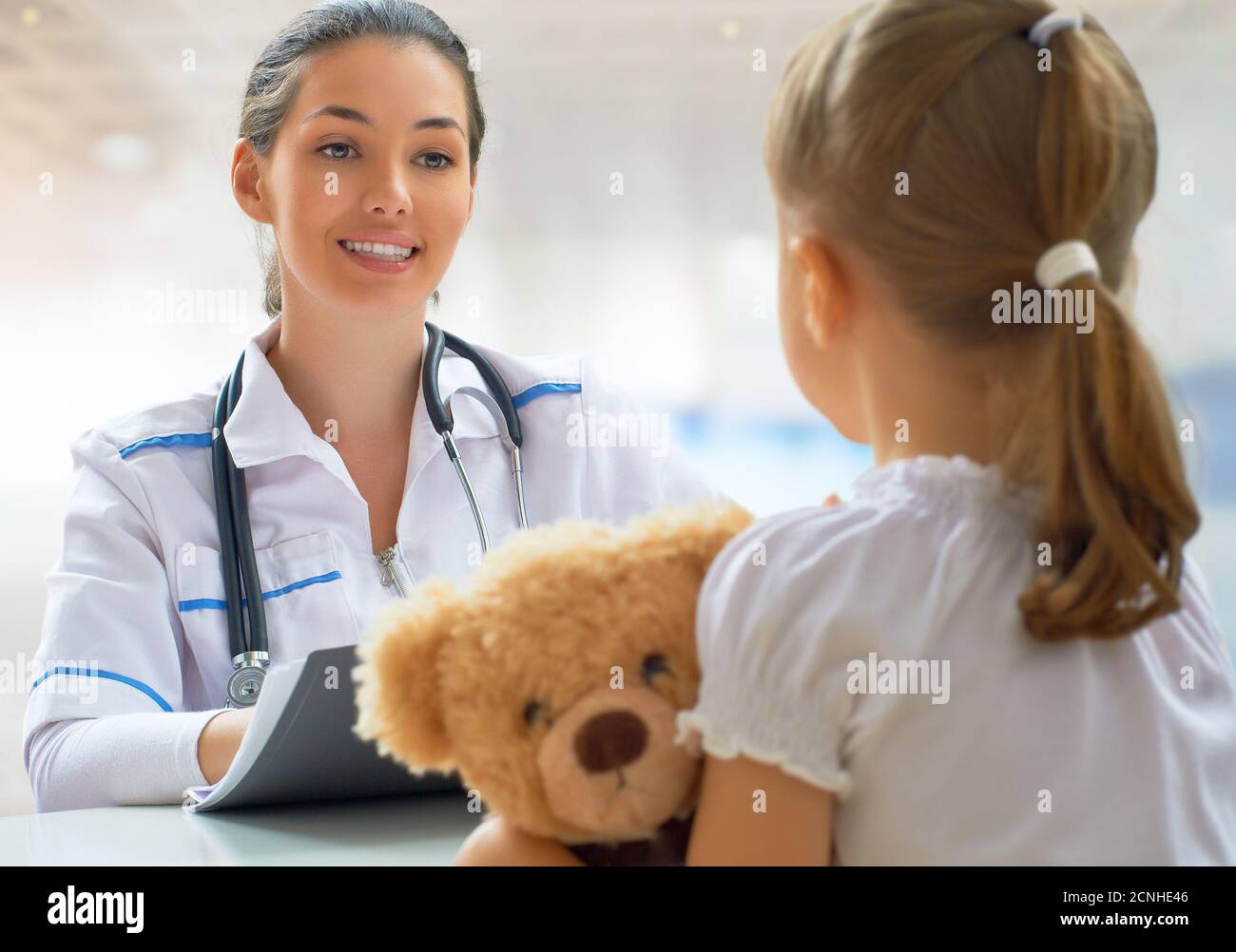 doctor examining a child in a hospital Stock Photo - Alamy