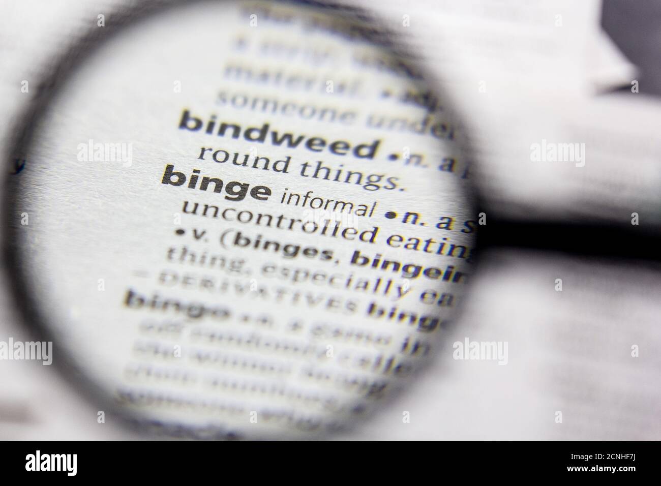 Word or phrase Binge in a dictionary Stock Photo - Alamy