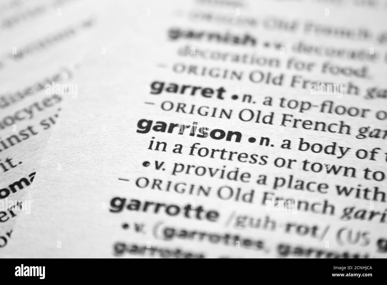 Word or phrase Garrison in a dictionary Stock Photo - Alamy