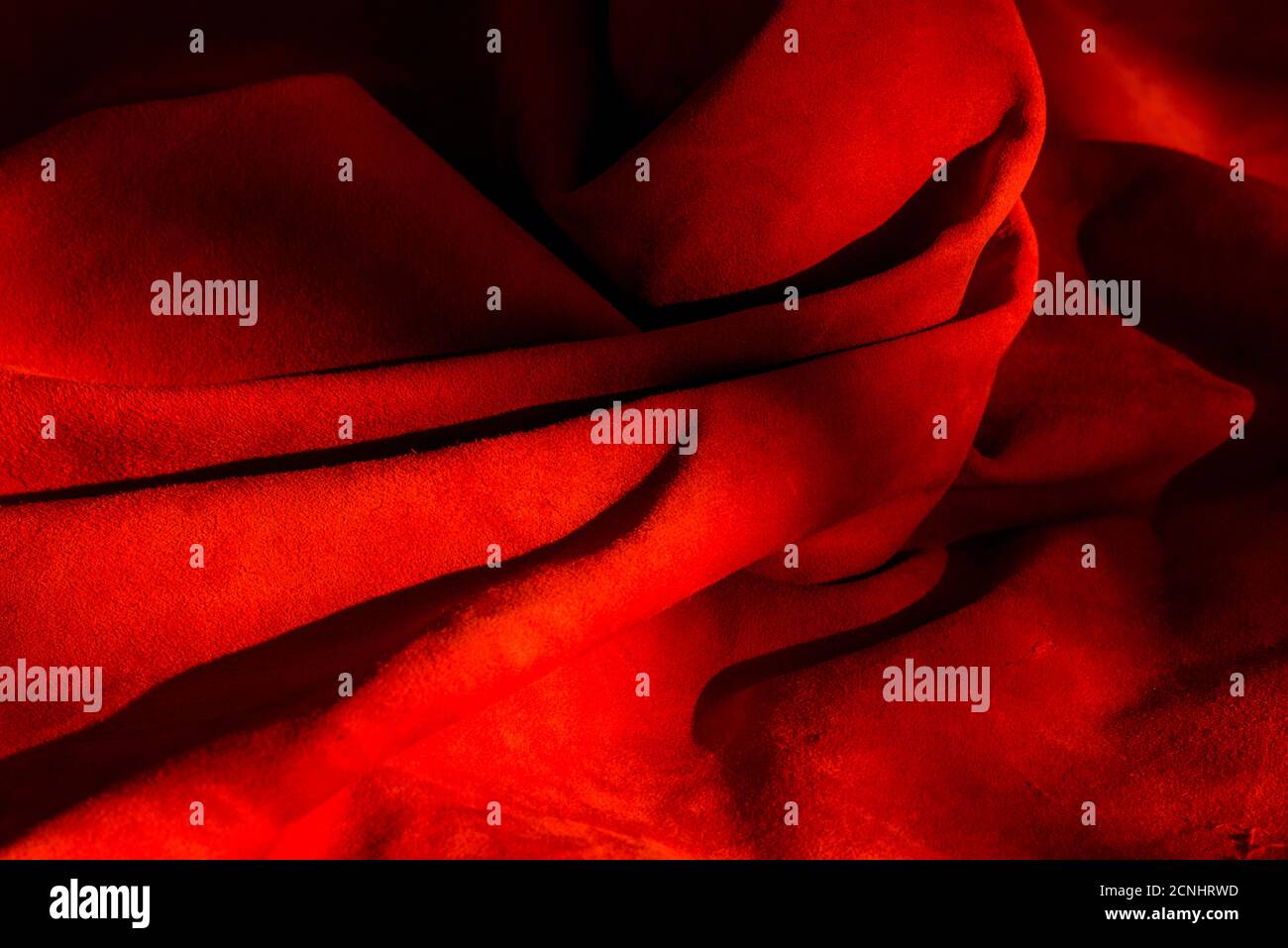 Dark red matte background of suede fabric, closeup. Velvet texture of ...