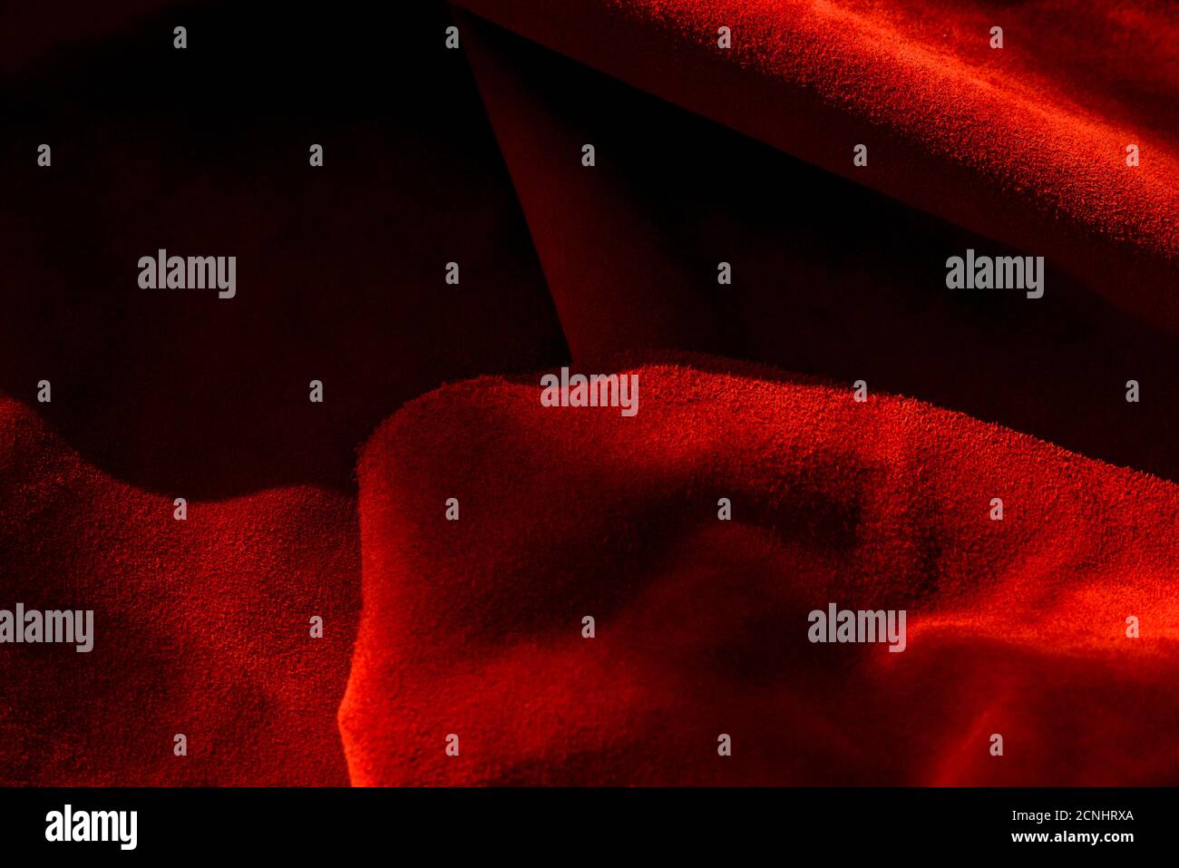 Dark red matte background of suede fabric, closeup. Velvet texture of ...