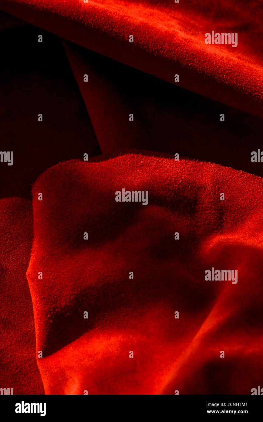 Dark red matte background of suede fabric, closeup. Velvet texture of ...