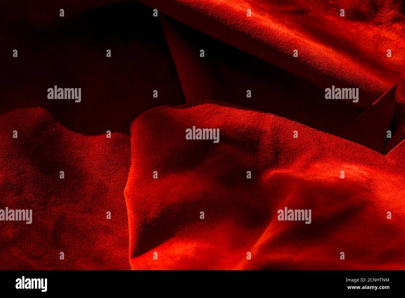 Dark red matte background of suede fabric, closeup. Velvet texture of ...