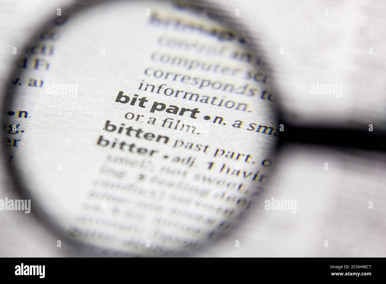 Word or phrase Bit part in a dictionary Stock Photo - Alamy