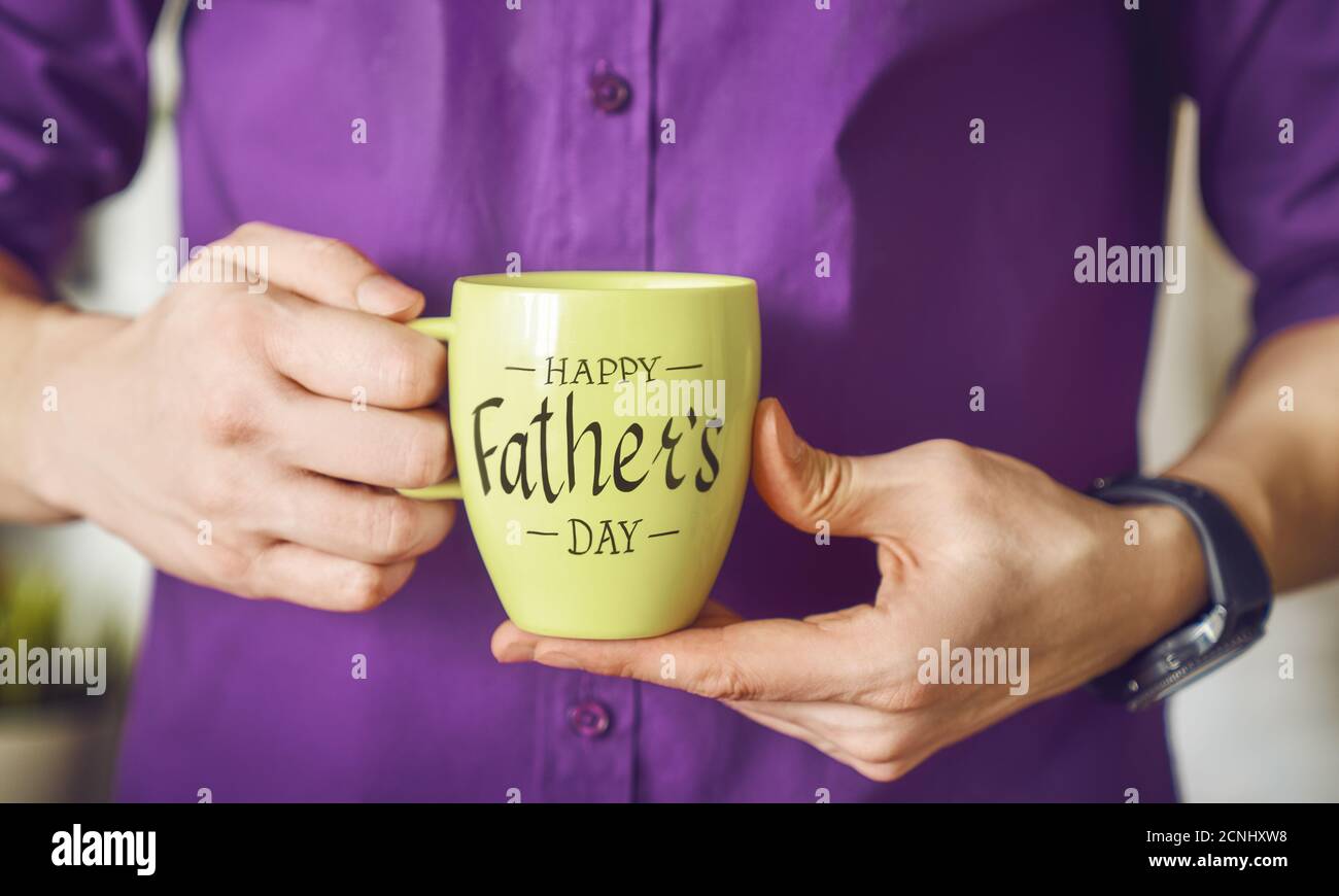 Happy father's day! Man holding cup of coffee Stock Photo - Alamy