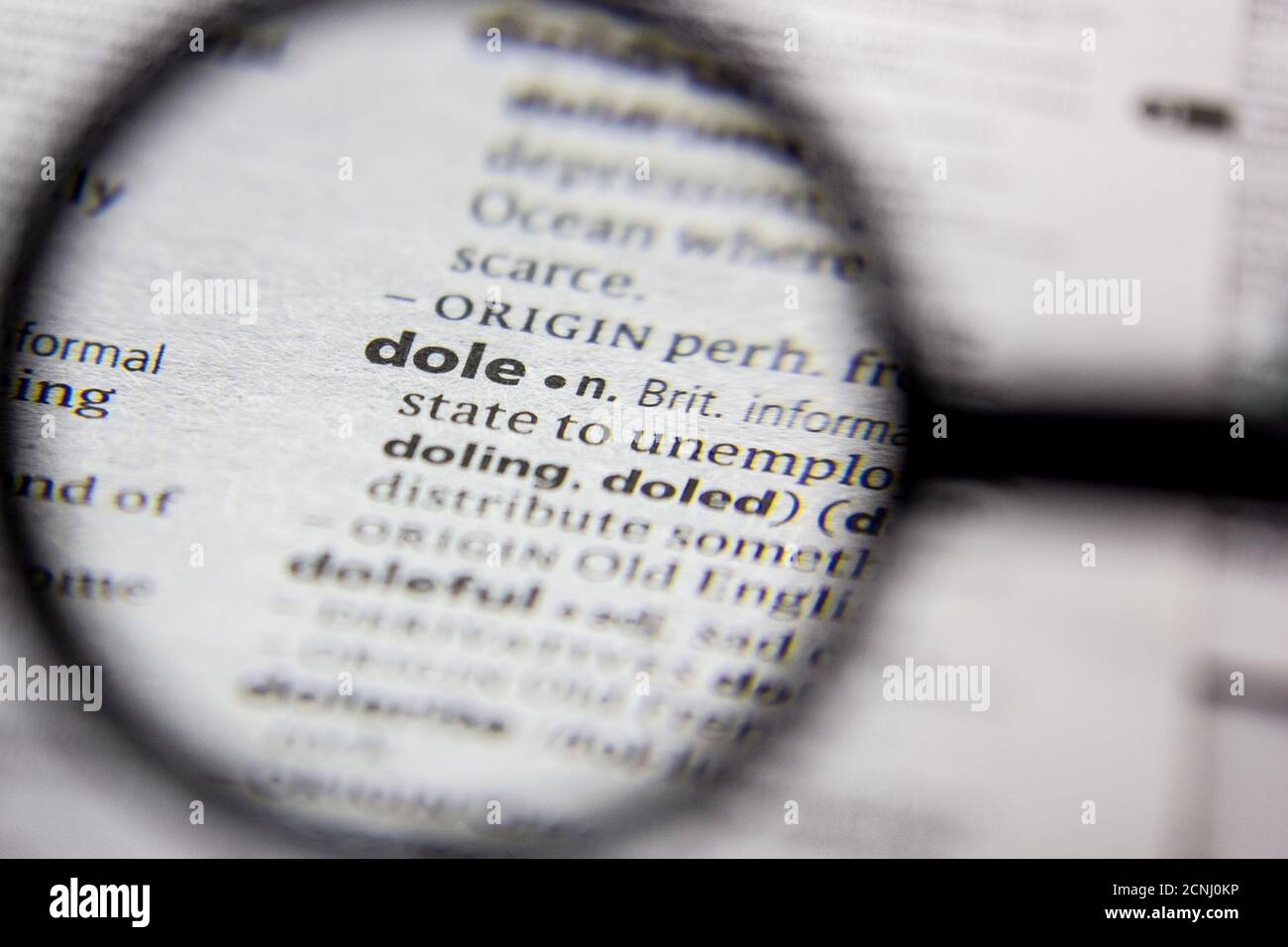 Word or phrase Dole in a dictionary Stock Photo - Alamy
