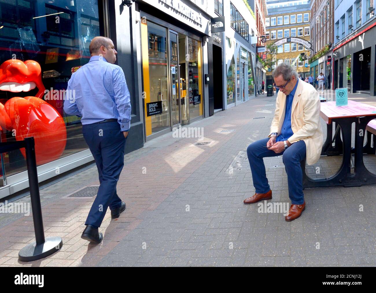 London, England, UK. Man on his mobile phone in Carnaby Street Stock ...