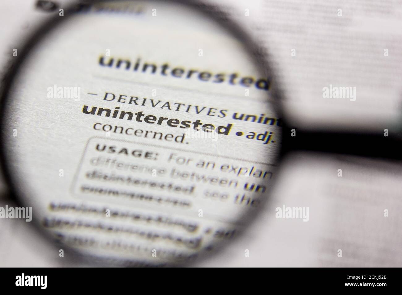 Word or phrase Uninterested in a dictionary Stock Photo - Alamy