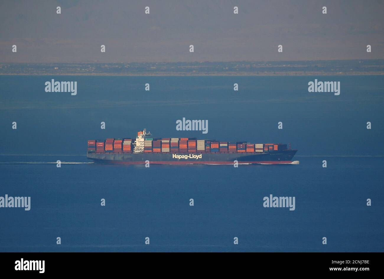 A Hapag Lloyd container ship sails across the Gulf of Suez towards the ...