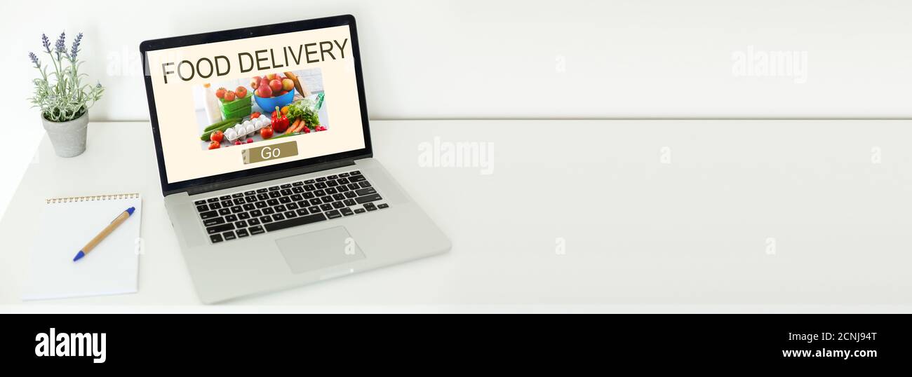 Food take away website in a laptop screen. Lunch at the office Stock ...