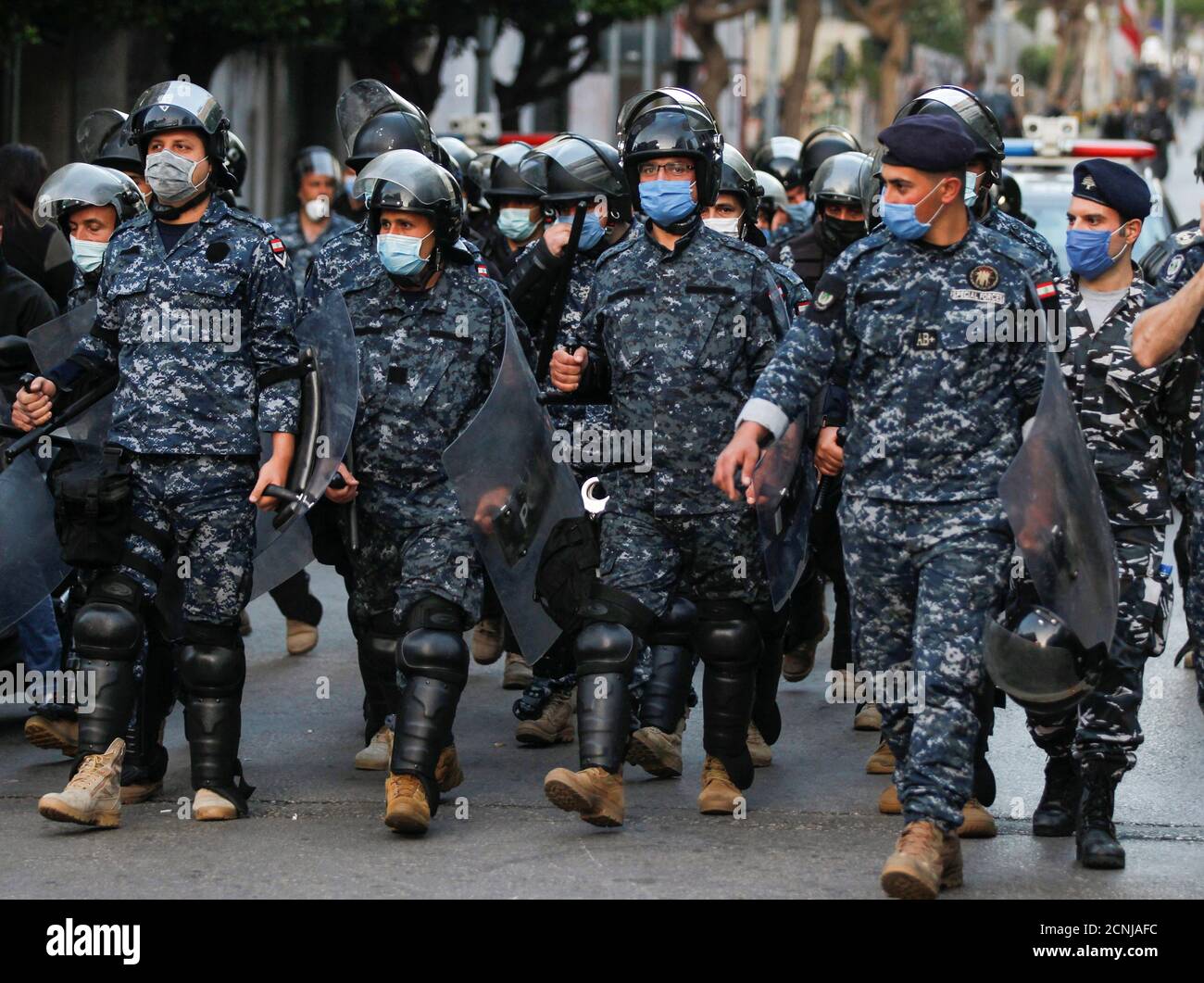 Police with face masks hi-res stock photography and images - Alamy