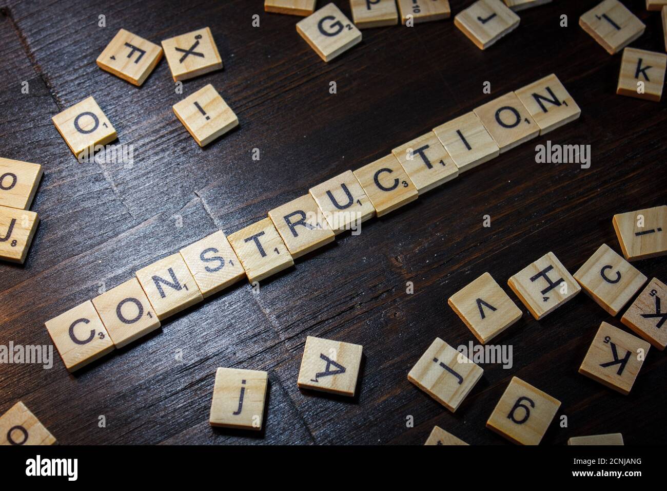 Word or phrase Construction made with scrabble letters on black table ...