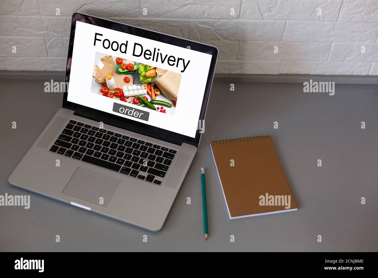 Food take away website in a laptop screen. Lunch at the office Stock ...
