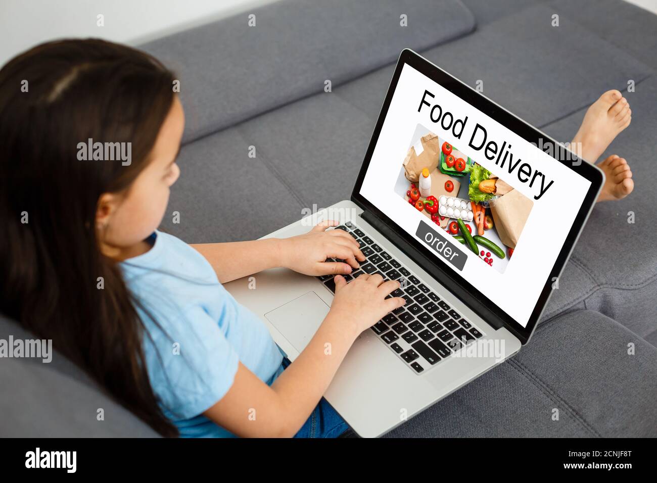 Food take away website in a laptop screen. Lunch at the office Stock ...