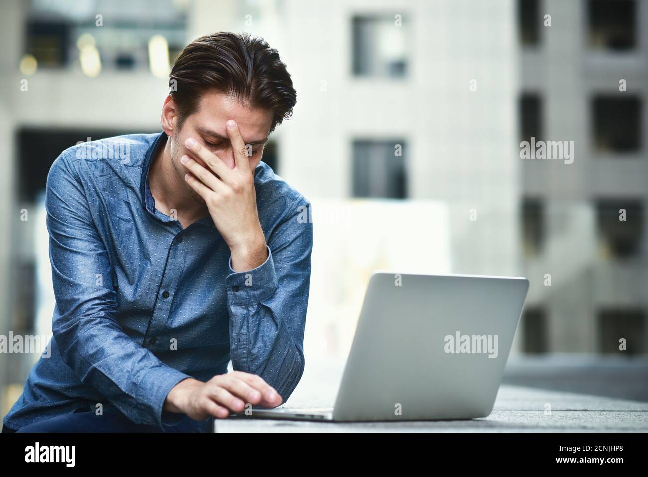 Fail. Businessman failed his project closed his face. Young freelancer ...