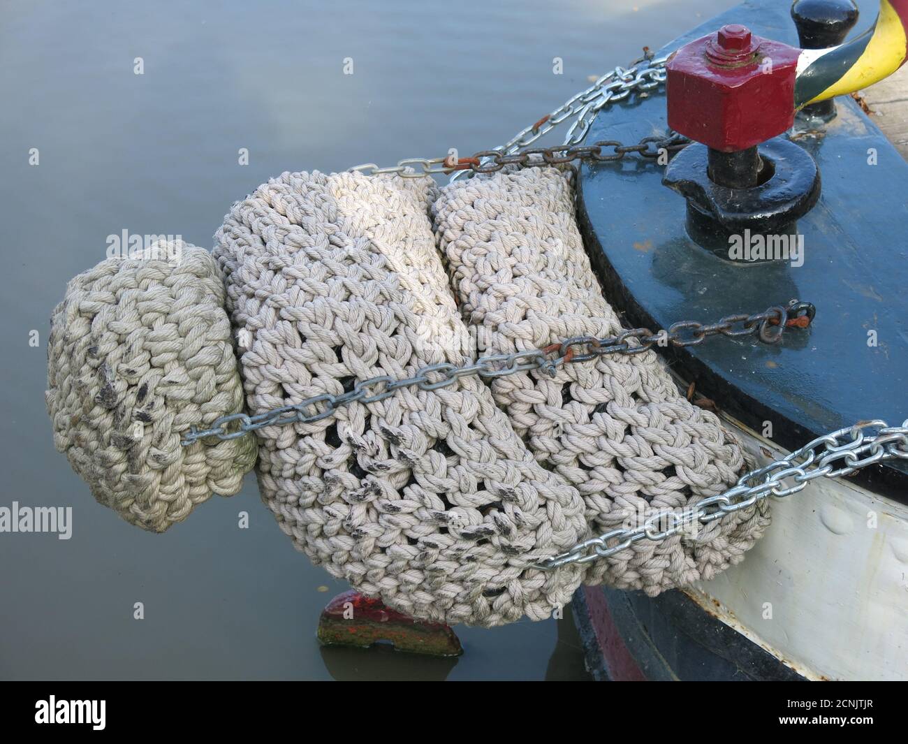 Close-up of the 3-part knotted rope fender that provides protection ...