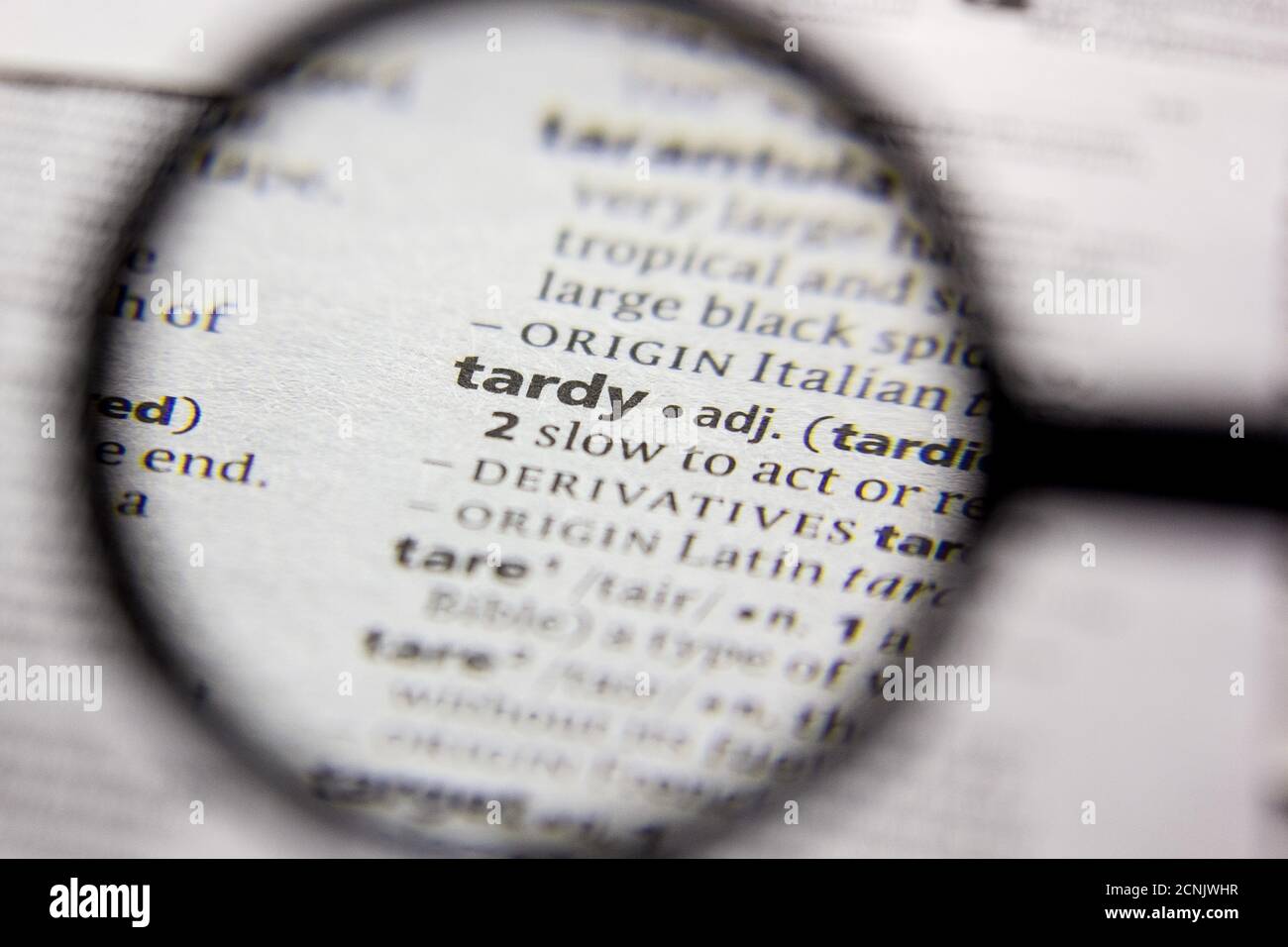 Word or phrase Tardy in a dictionary Stock Photo - Alamy