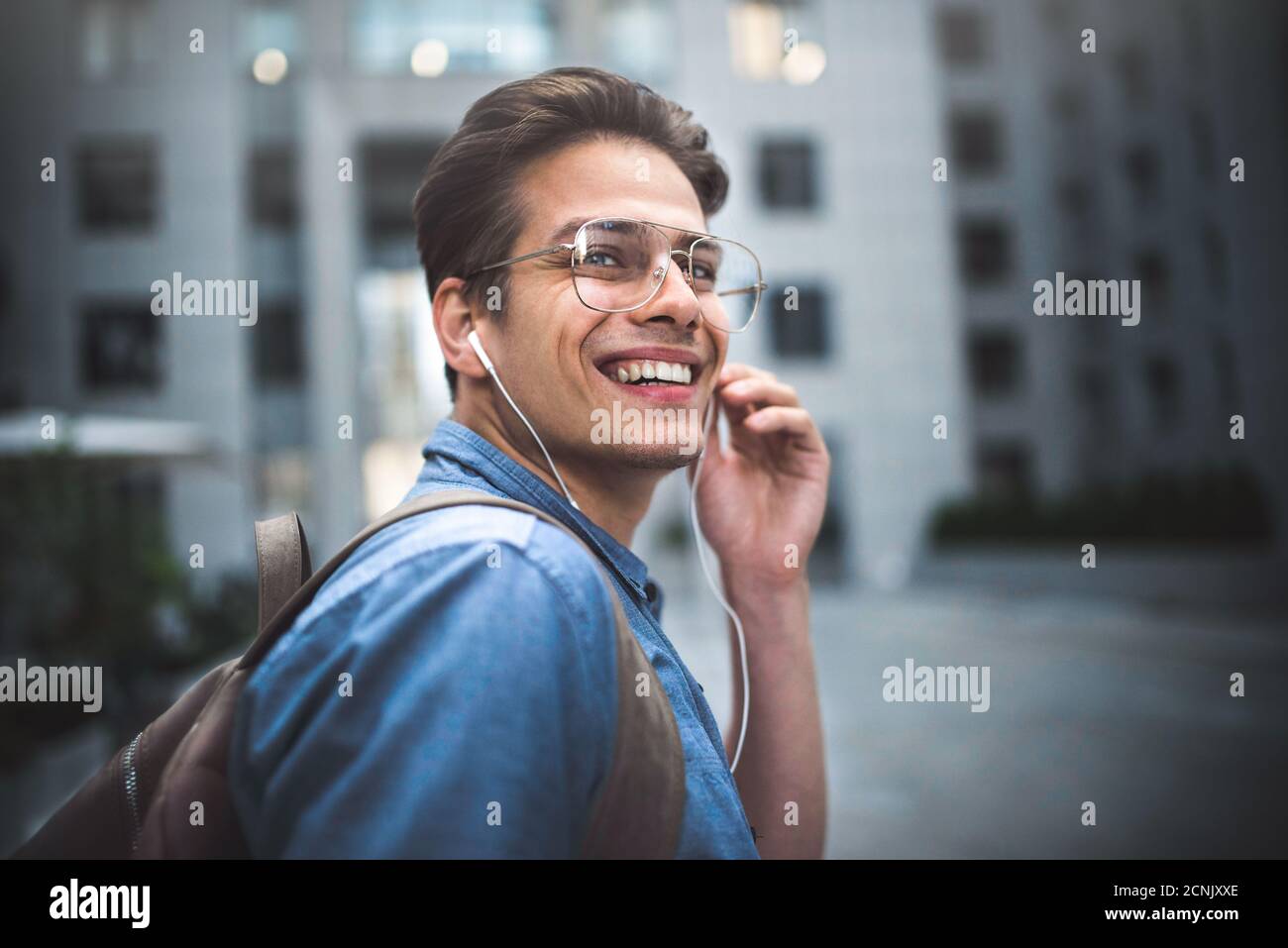Portrait walking young man headphones hi-res stock photography and images - Alamy