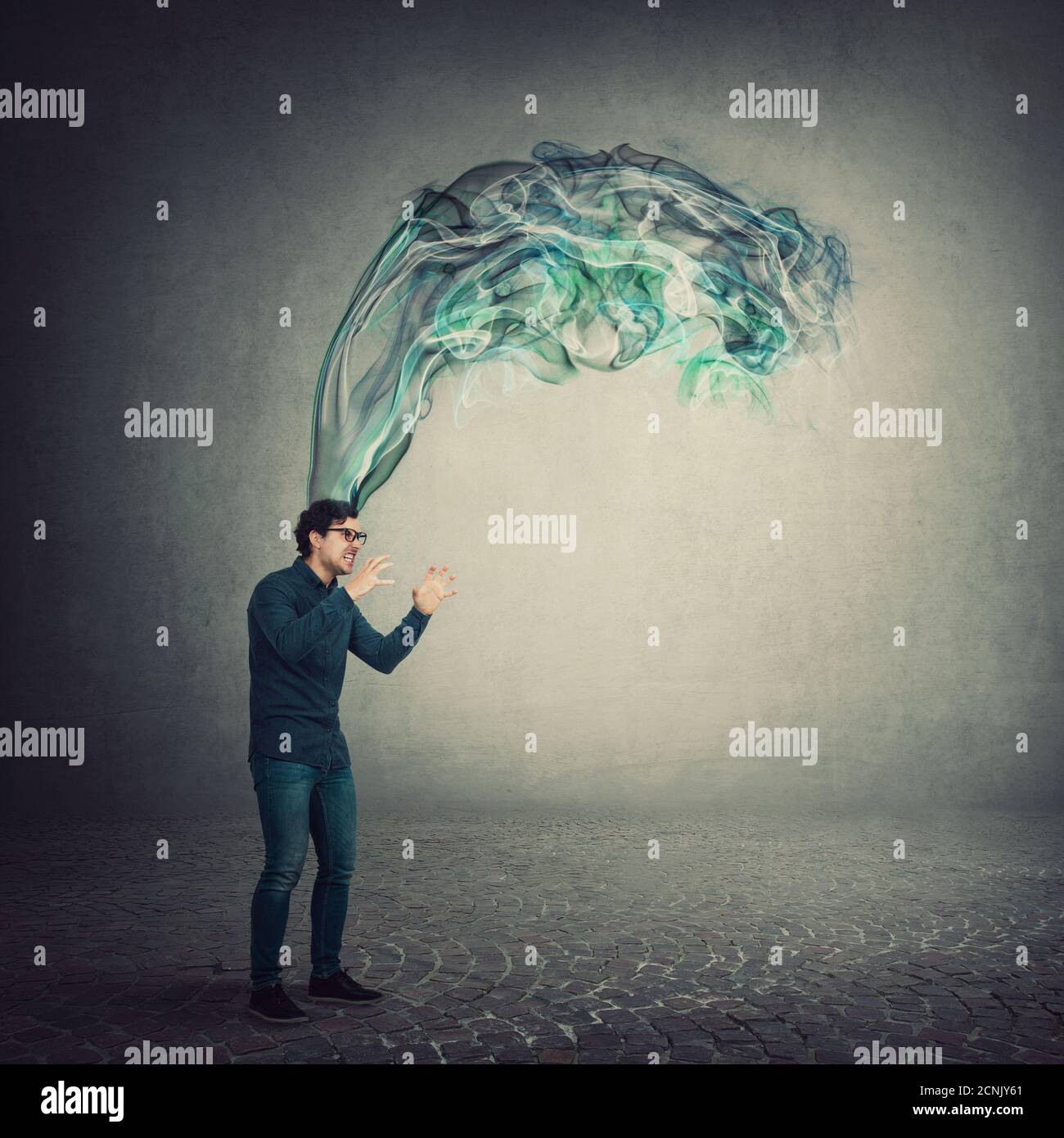 Angry businessman, furious expression and gesture, clenching teeth and ...