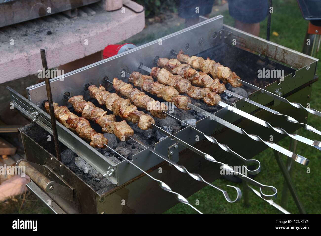 Roasted meat cooked at barbecue with smoke Stock Photo - Alamy