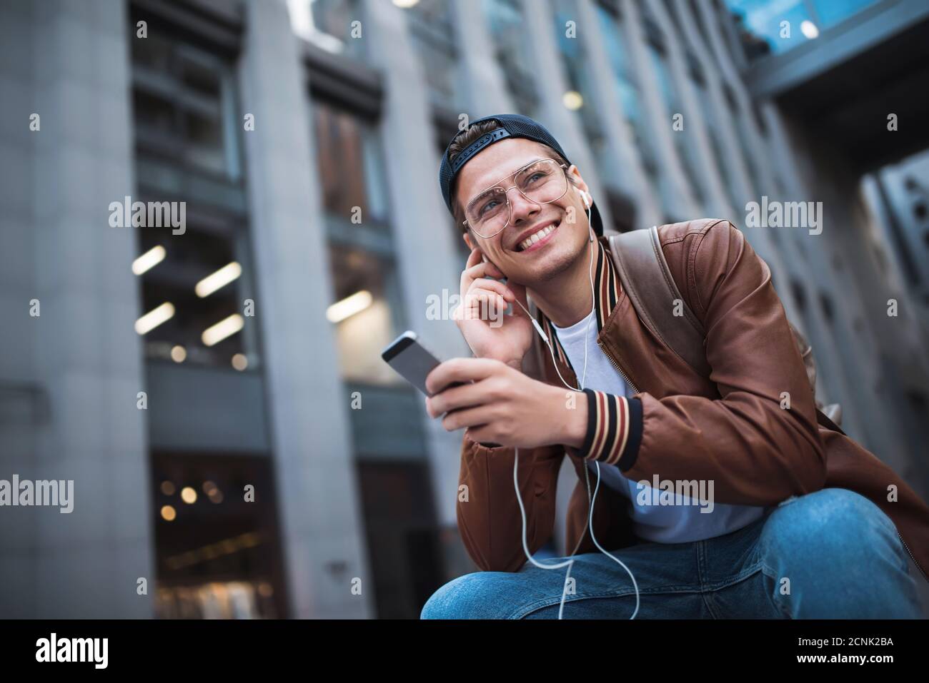 Say hello. Happy man meeting someone. Happy man listening to music with ...