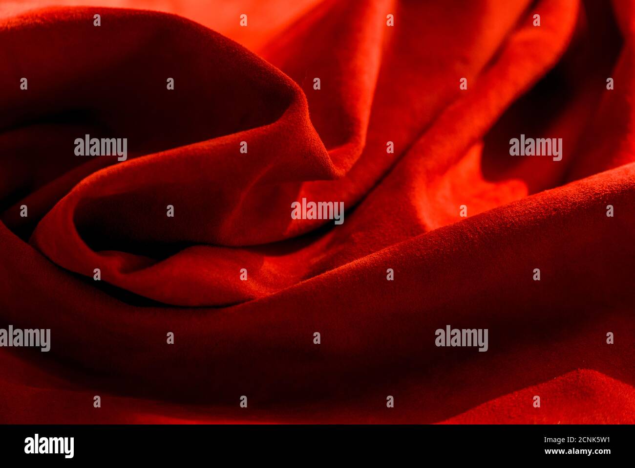 Dark red matte background of suede fabric, closeup. Velvet texture of ...