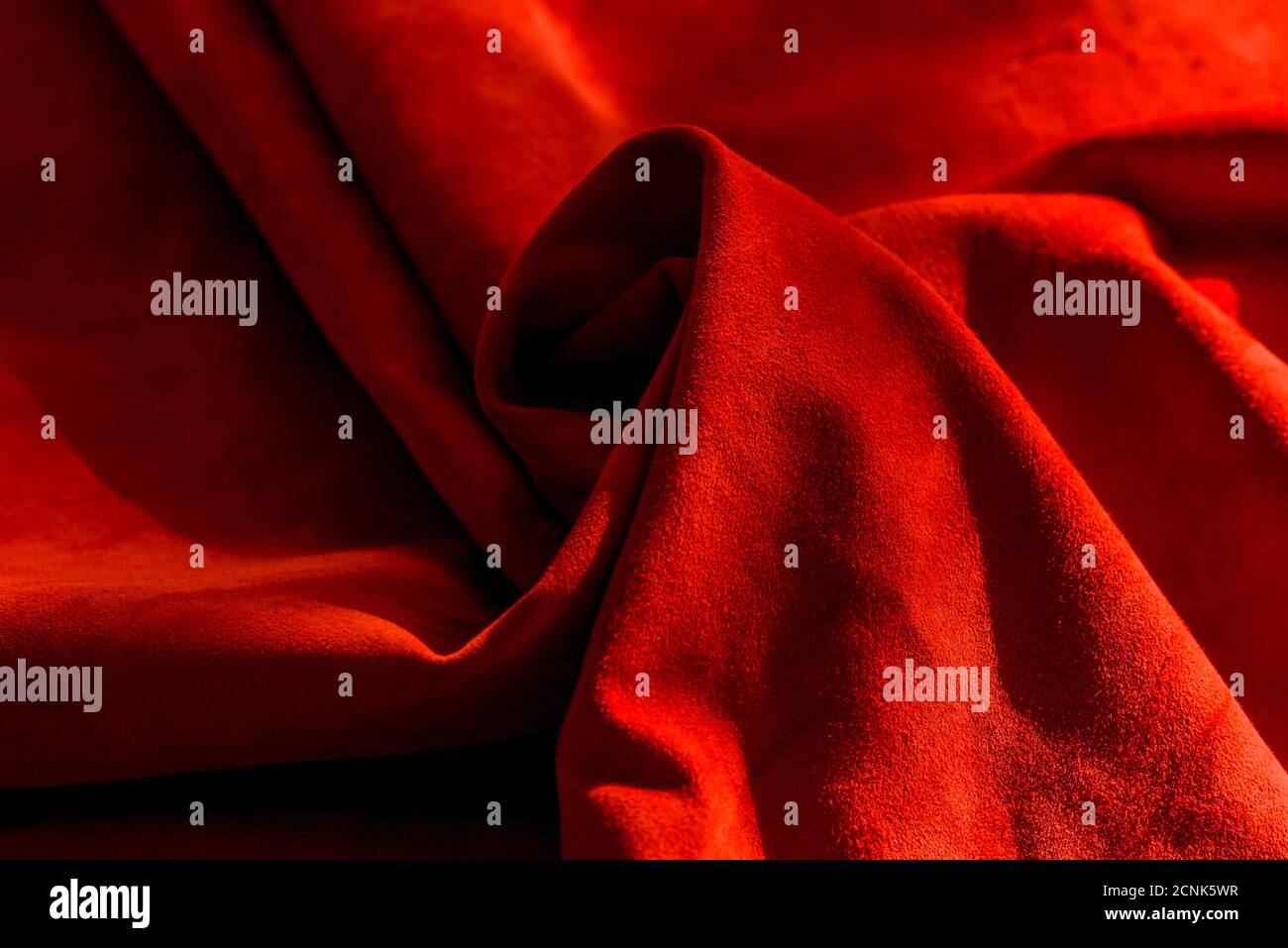 Dark red matte background of suede fabric, closeup. Velvet texture of ...